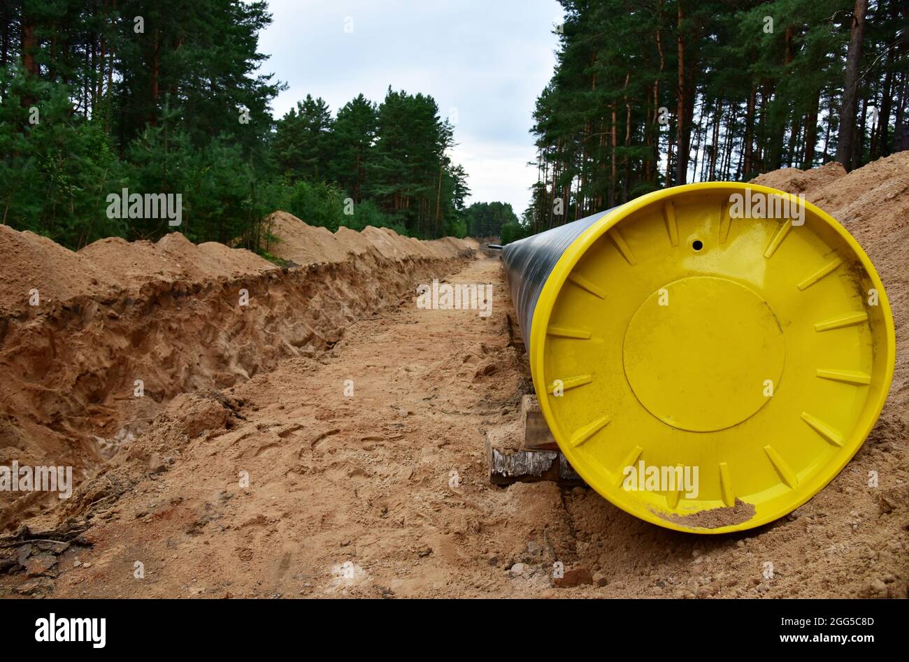 Natural Gas Pipeline Construction. Laying oil pipe in a trench in the ...