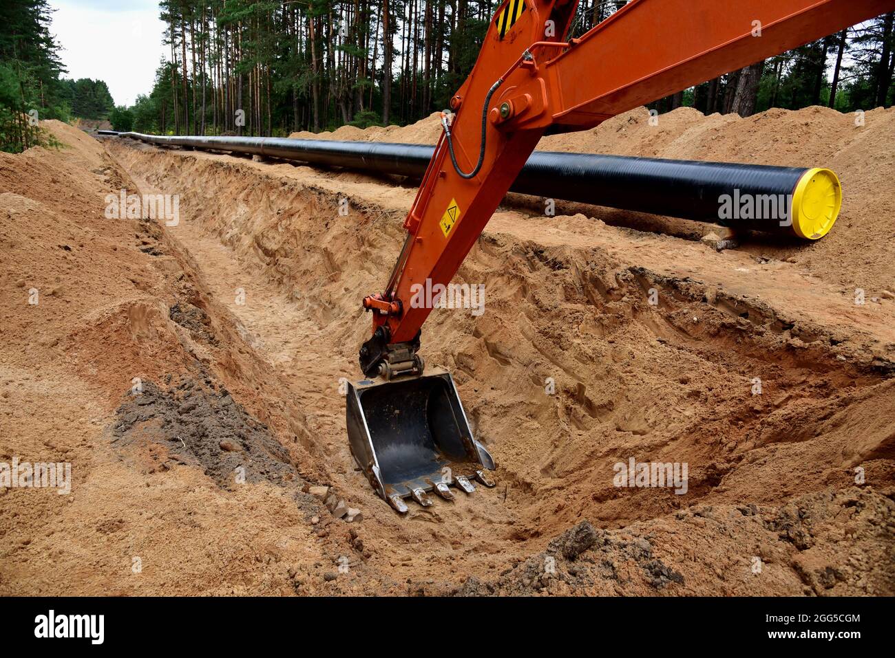 Natural Gas Pipeline Construction. Laying oil pipe in a trench in the ...