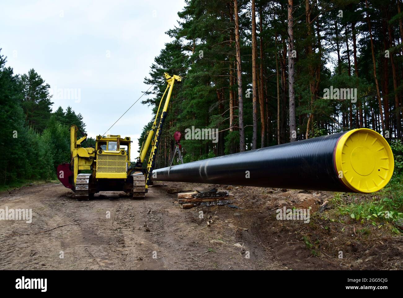 Natural Gas Pipeline Construction. Laying oil pipe in a trench in the ...