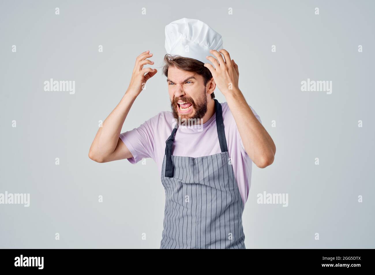 bearded male chef work in a restaurant industry cooking Stock Photo - Alamy