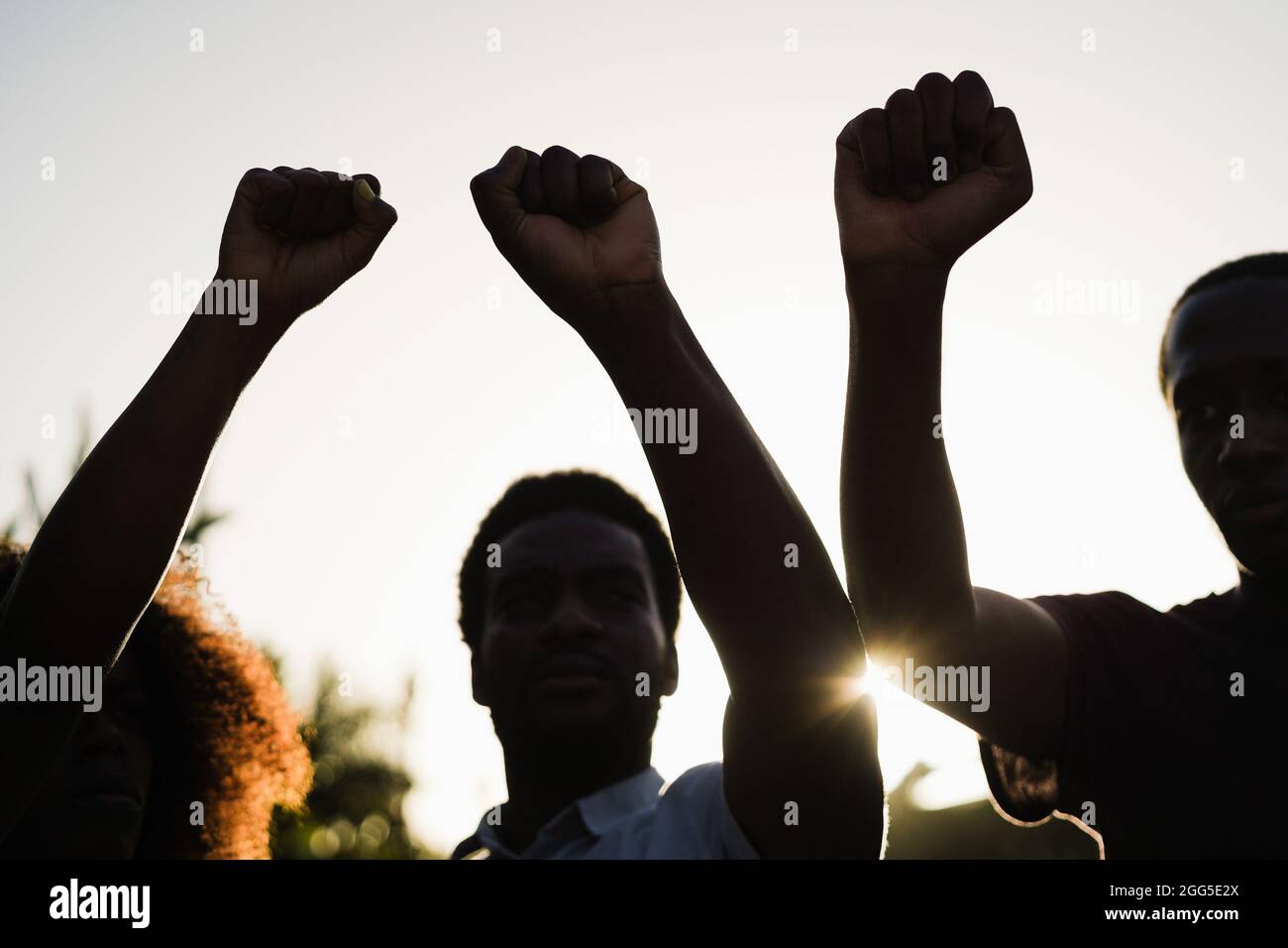 Black demonstrator people holding hands against racism protest - Focus ...