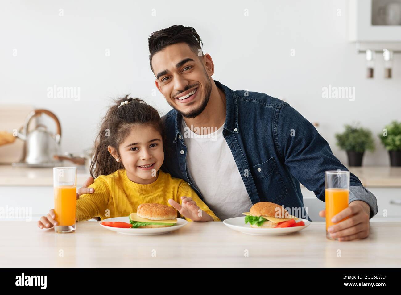 Lunch With Dad. Middle-Eastern Father And Little Daughter Eating ...