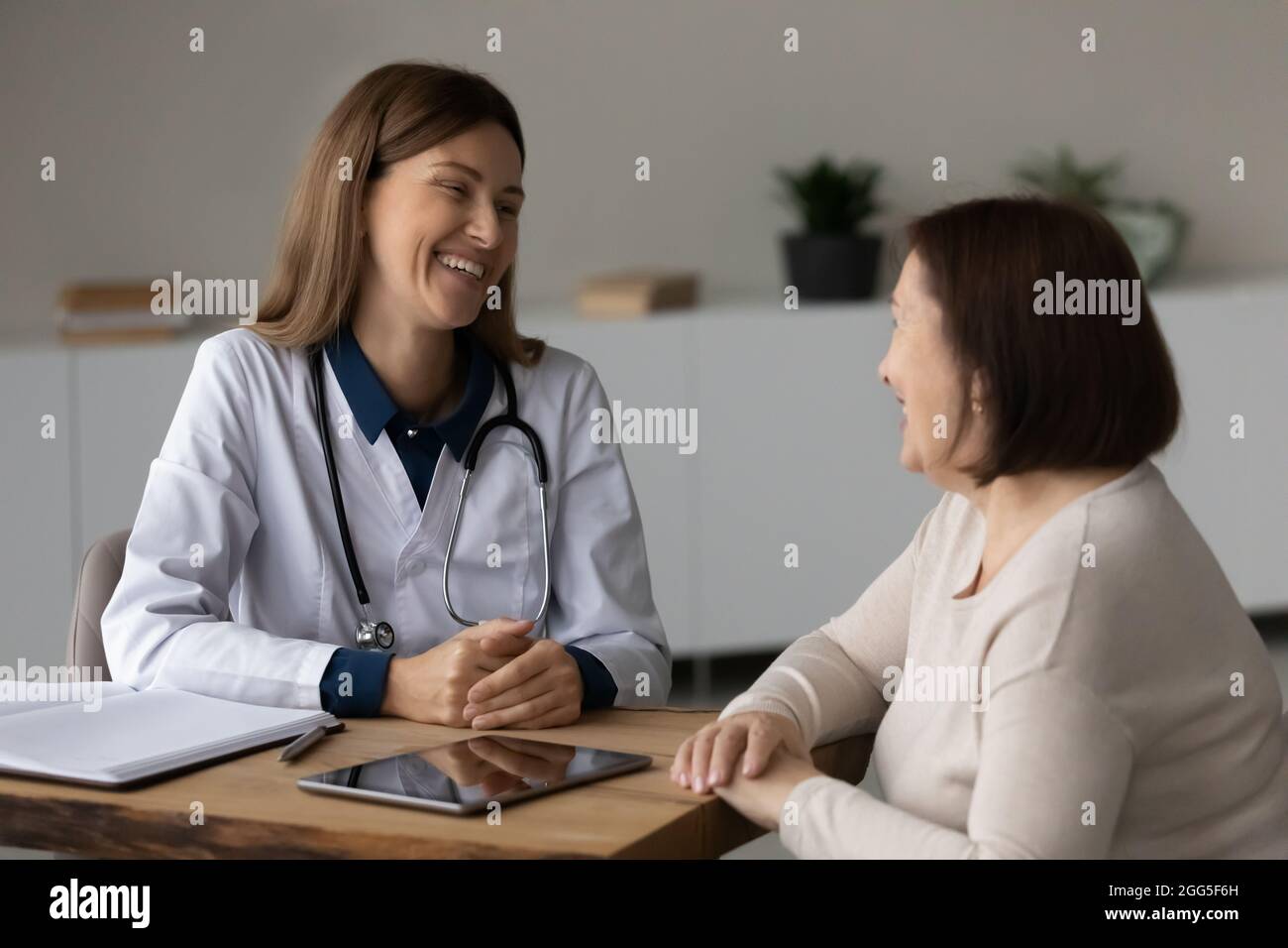 Happy talking to gp hi-res stock photography and images - Alamy