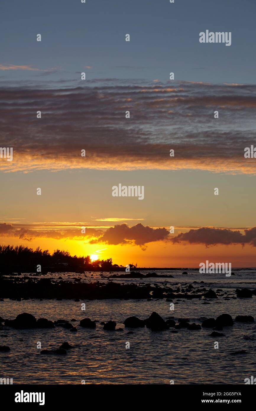 Rocky beach in the north of the island at sunset, Mauritius Stock Photo ...