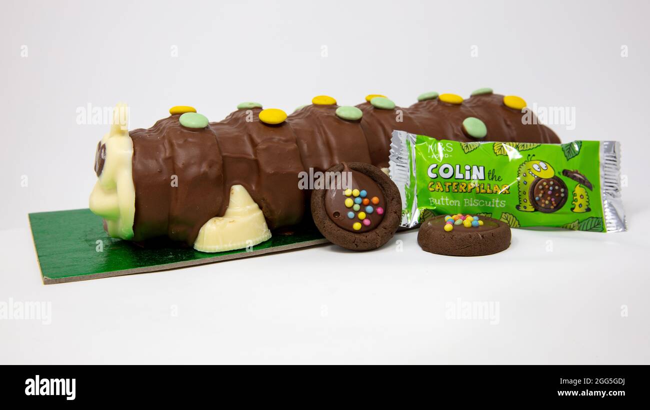 M&S Colin The Caterpillar Cake and Button Biscuits Stock Photo - Alamy