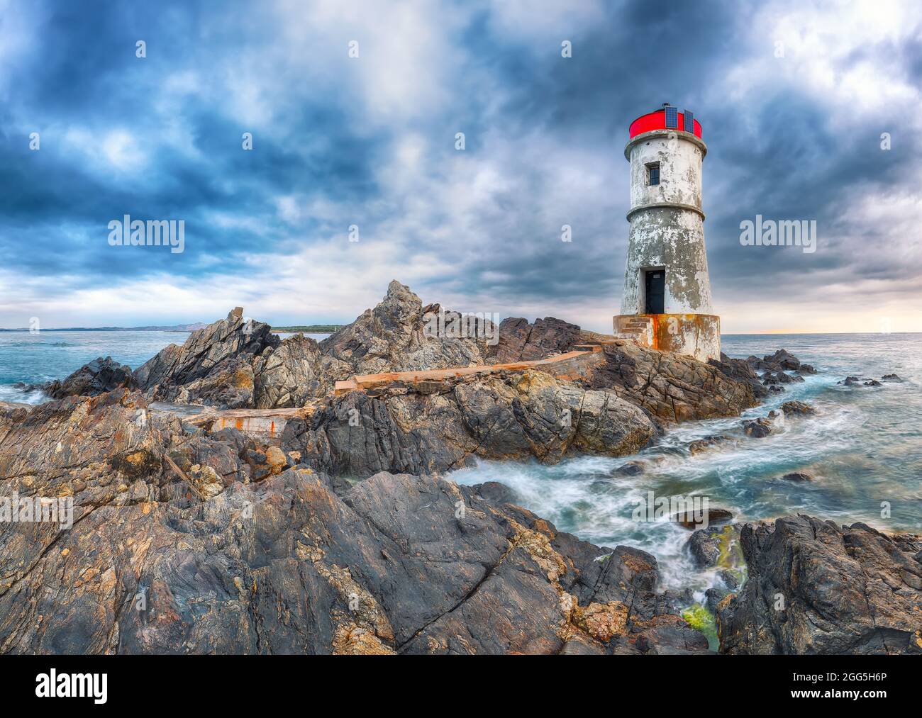 Gorgeous gloomy view of Capo Ferro Lighthouse. Popular travel ...