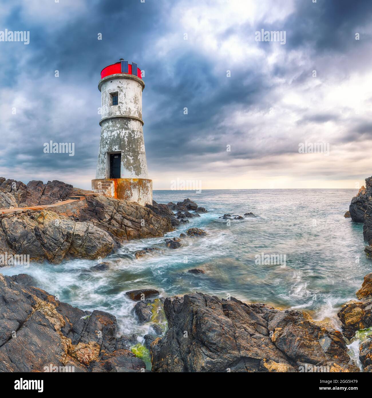 Gorgeous gloomy view of Capo Ferro Lighthouse. Popular travel ...
