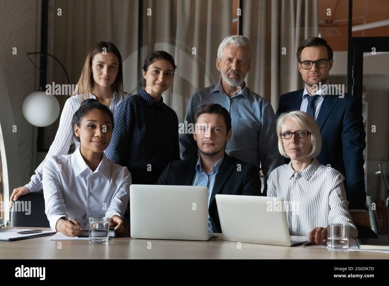 Portrait of diverse businesspeople employees team standing in office ...