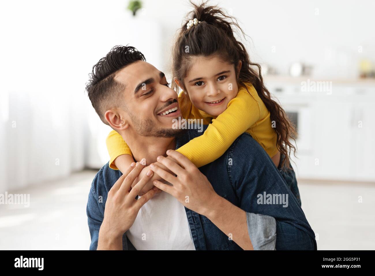 Closeup portrait of happy middle-eastern father and little daughter ...