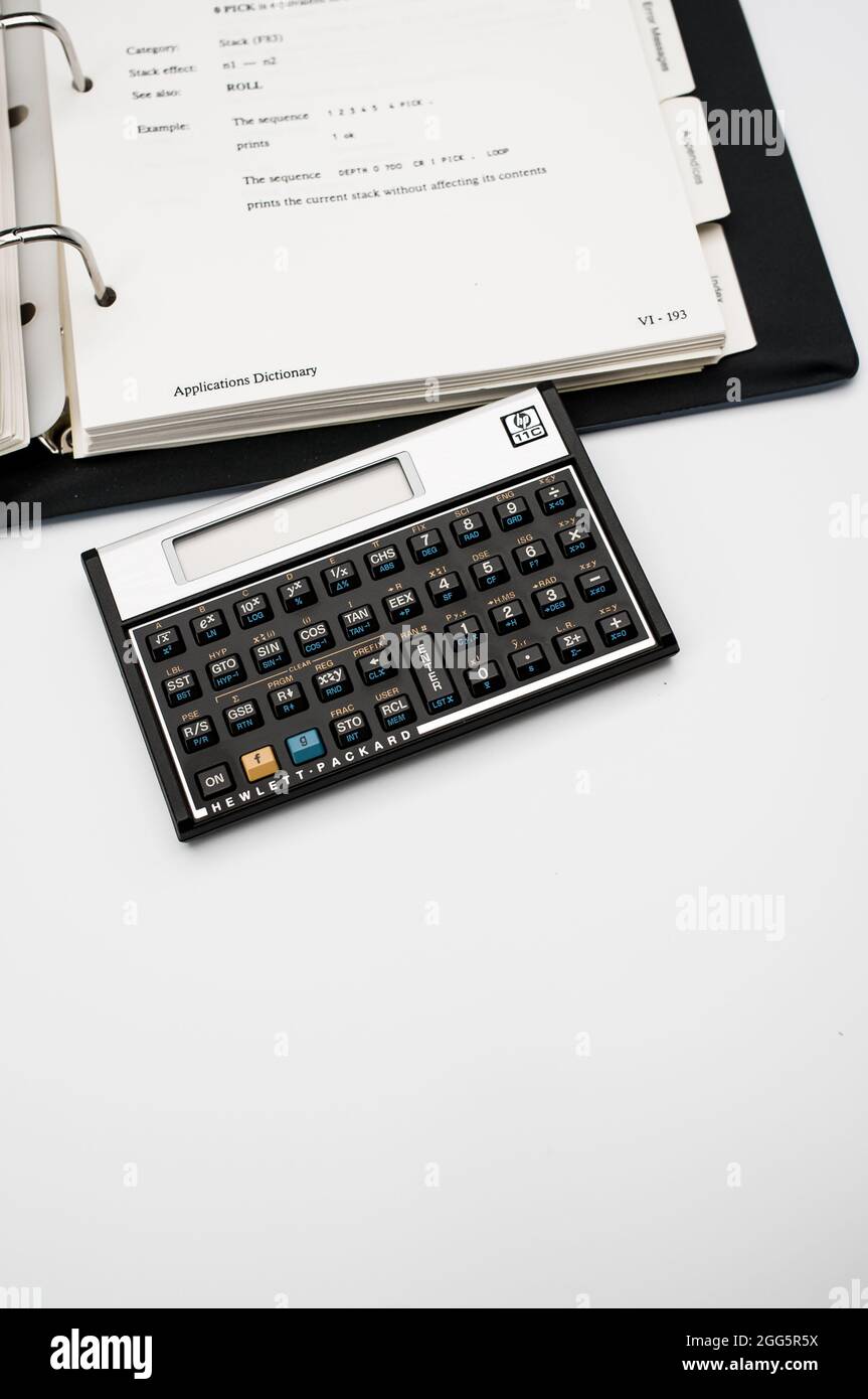 Top view of programming language books and manuals and calculator on a ...