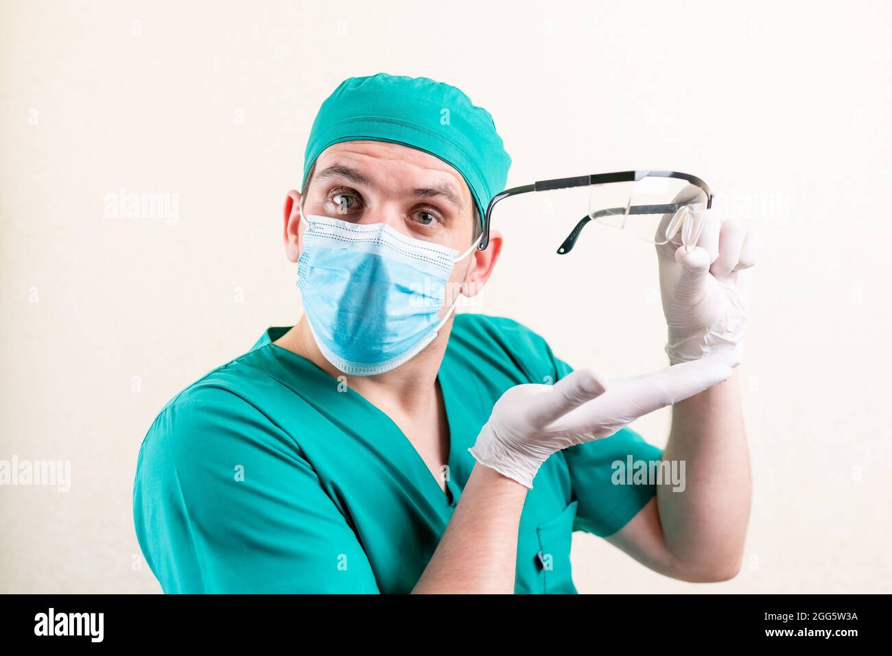 Doctor with goggles in his hands Stock Photo - Alamy