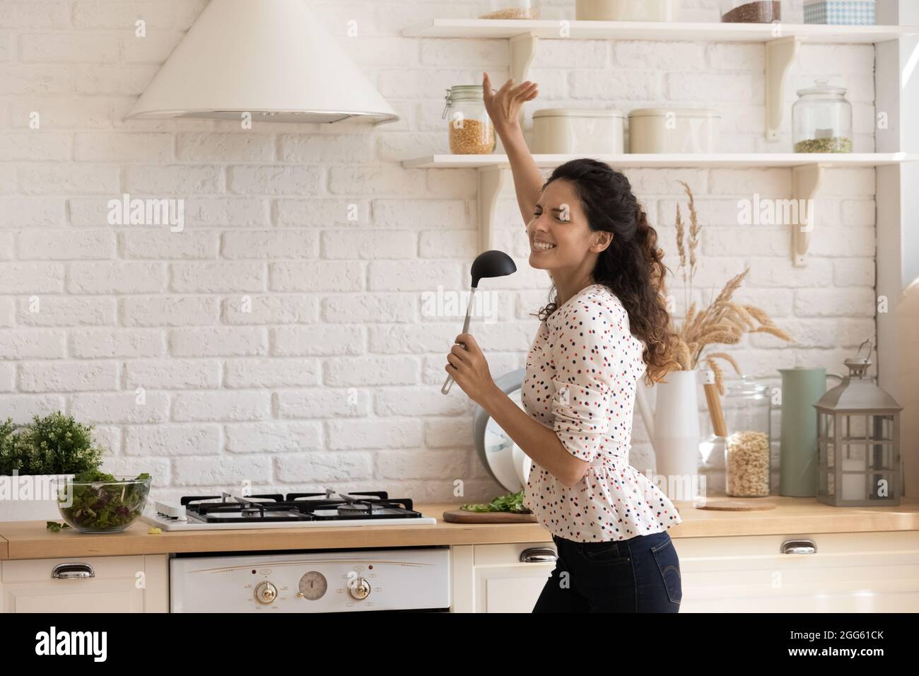 Happy crazy young hispanic woman singing song Stock Photo - Alamy