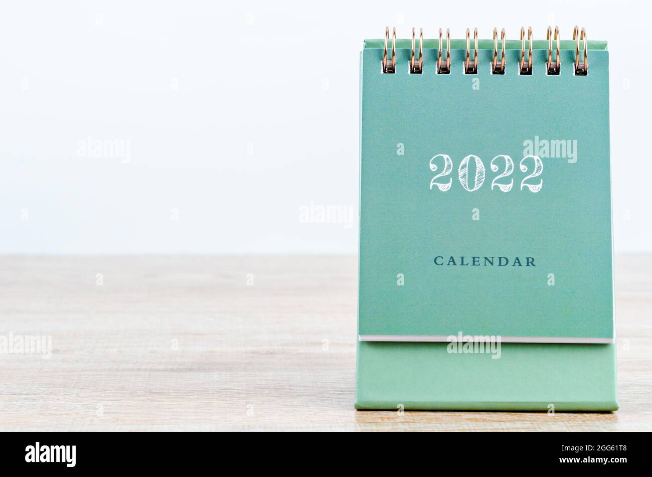 Mini desk calendar 2022 on wooden table Stock Photo - Alamy