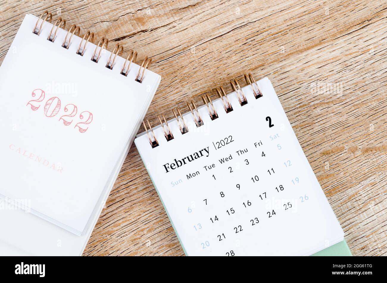 The mini February 2022 desk calendar on wooden background Stock Photo ...