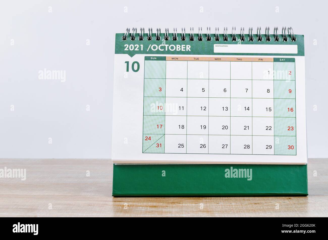 October 2021 green Desk calendar on wooden table Stock Photo - Alamy