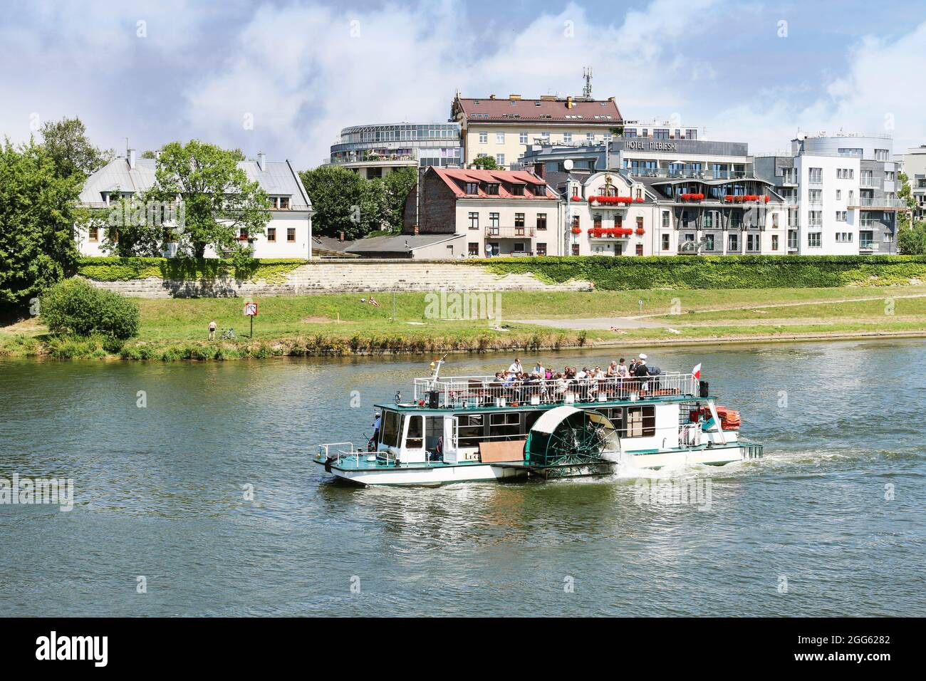 Ships with tourists at the Wisla river in Krakow, Poland Stock Photo ...