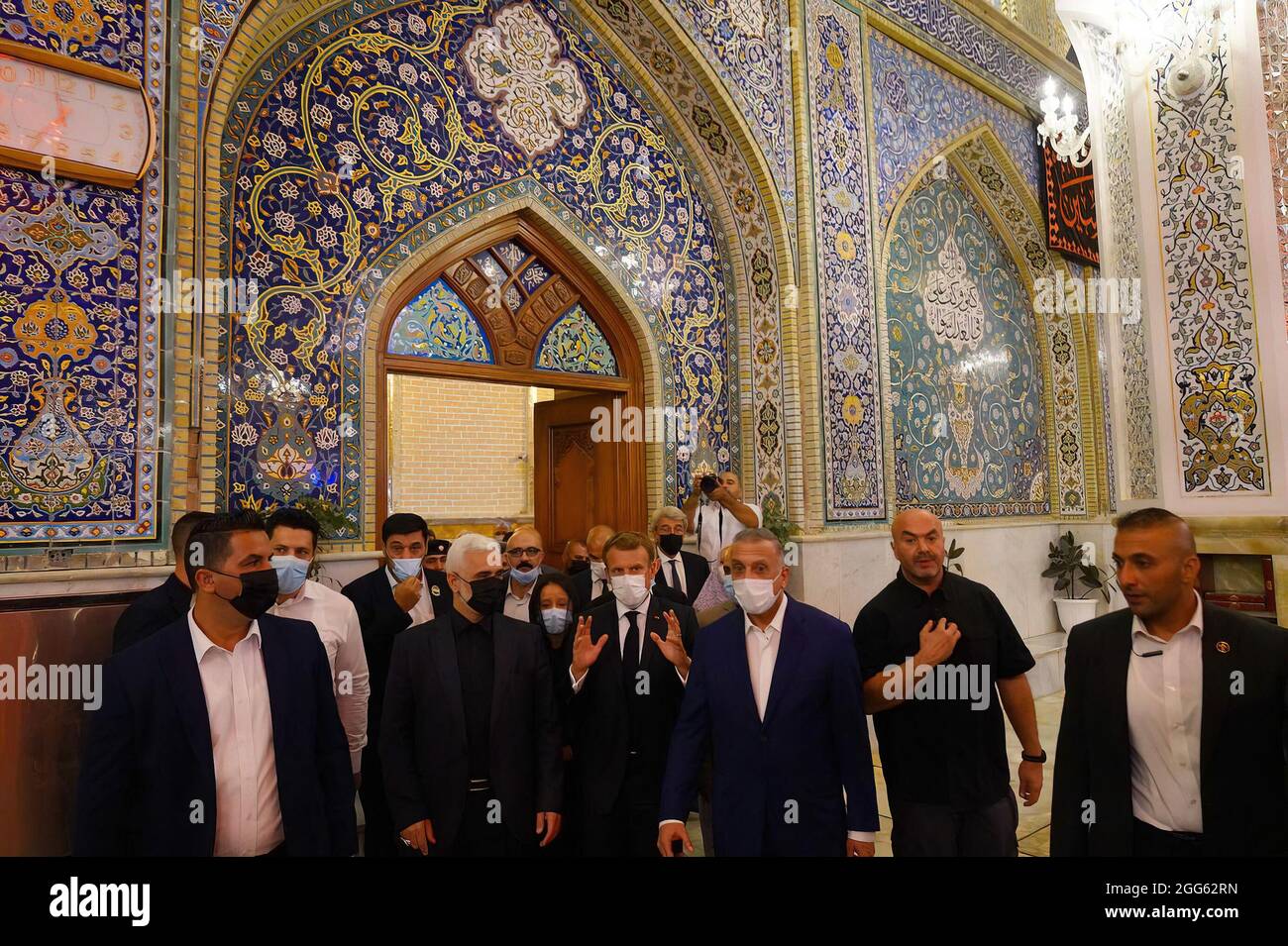 Iraqi Prime Minister Mustafa Al Kadhemi (center) and French president ...