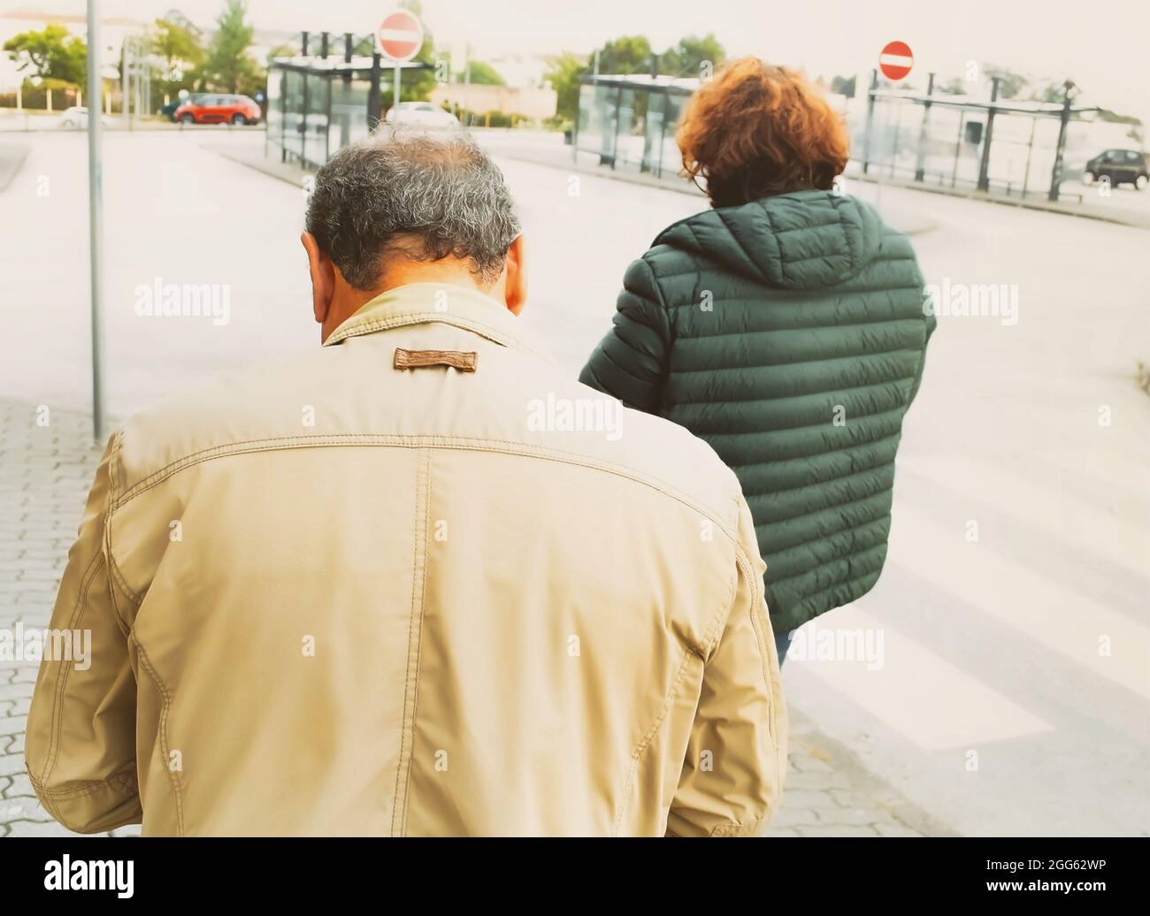 Two men walking on a street hi-res stock photography and images - Alamy
