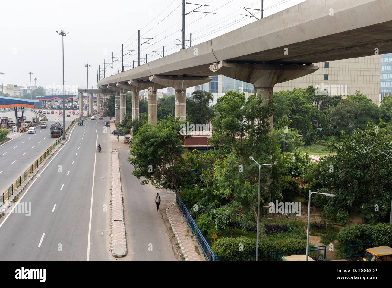 View of the Delhi metro line next to an express road between Delhi and ...