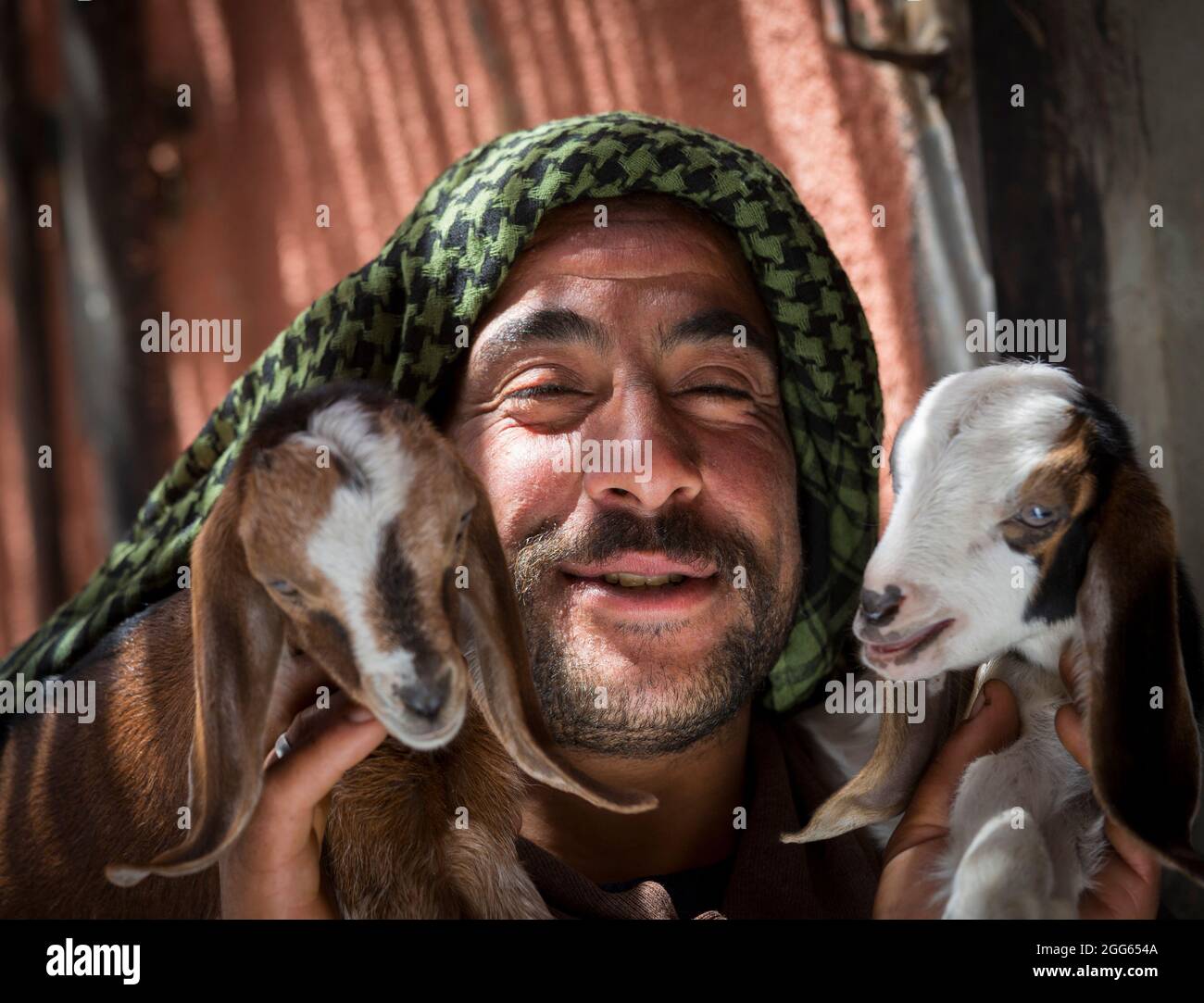Shepard with two kids - baby goats, Cairo, Egypt Stock Photo - Alamy