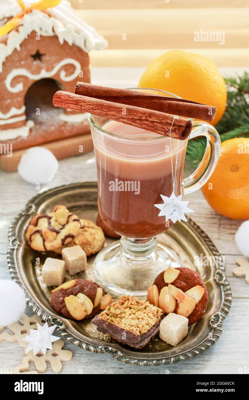 Christmas irish coffee, sweet biscuits and gingerbread house on the ...