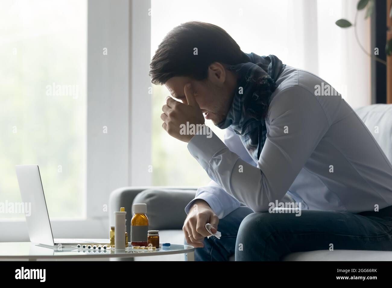 Young man headache using laptop hi-res stock photography and images - Alamy