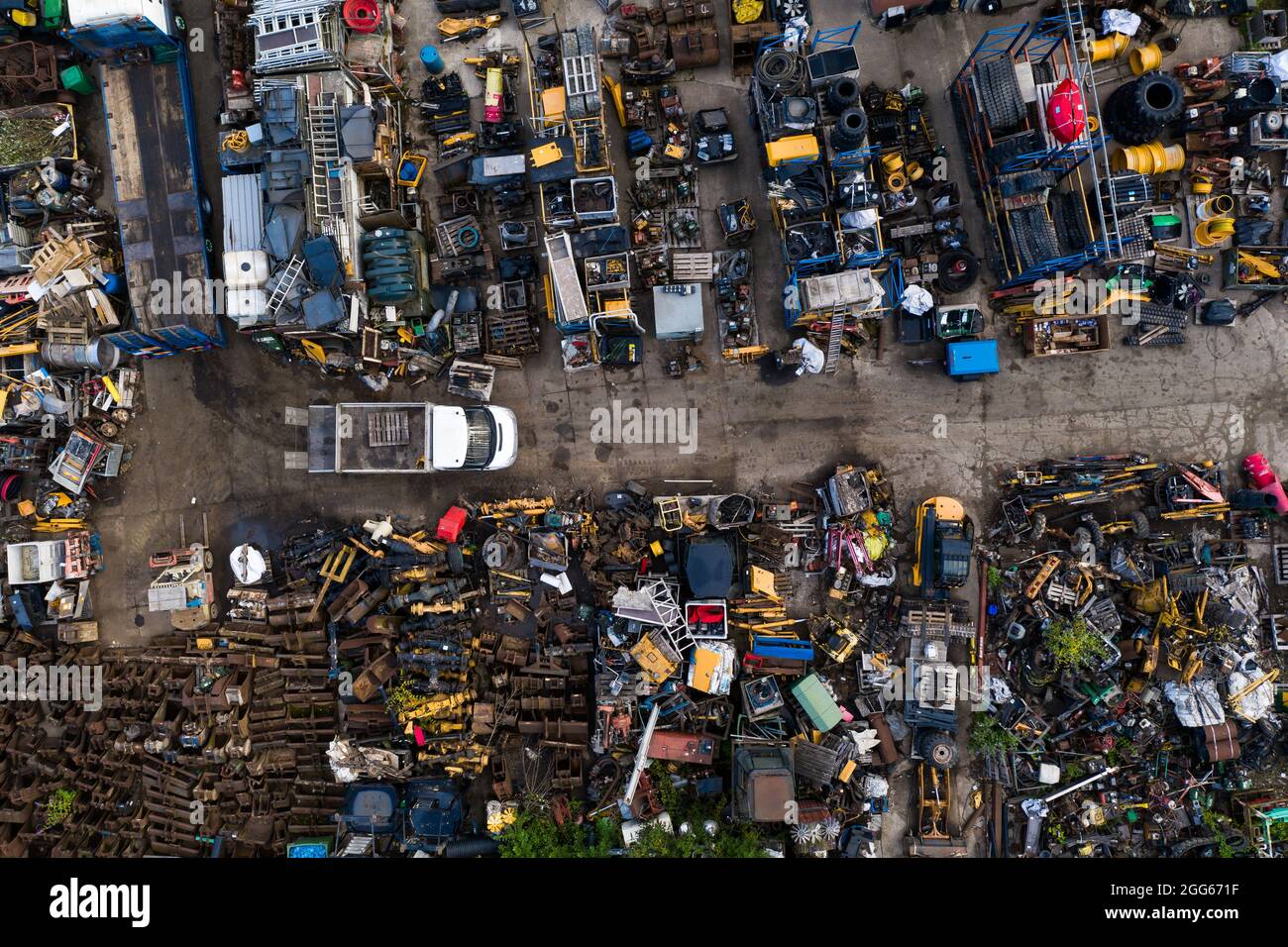 An aerial view looking down onto a scrapyard with scrap metal and ...