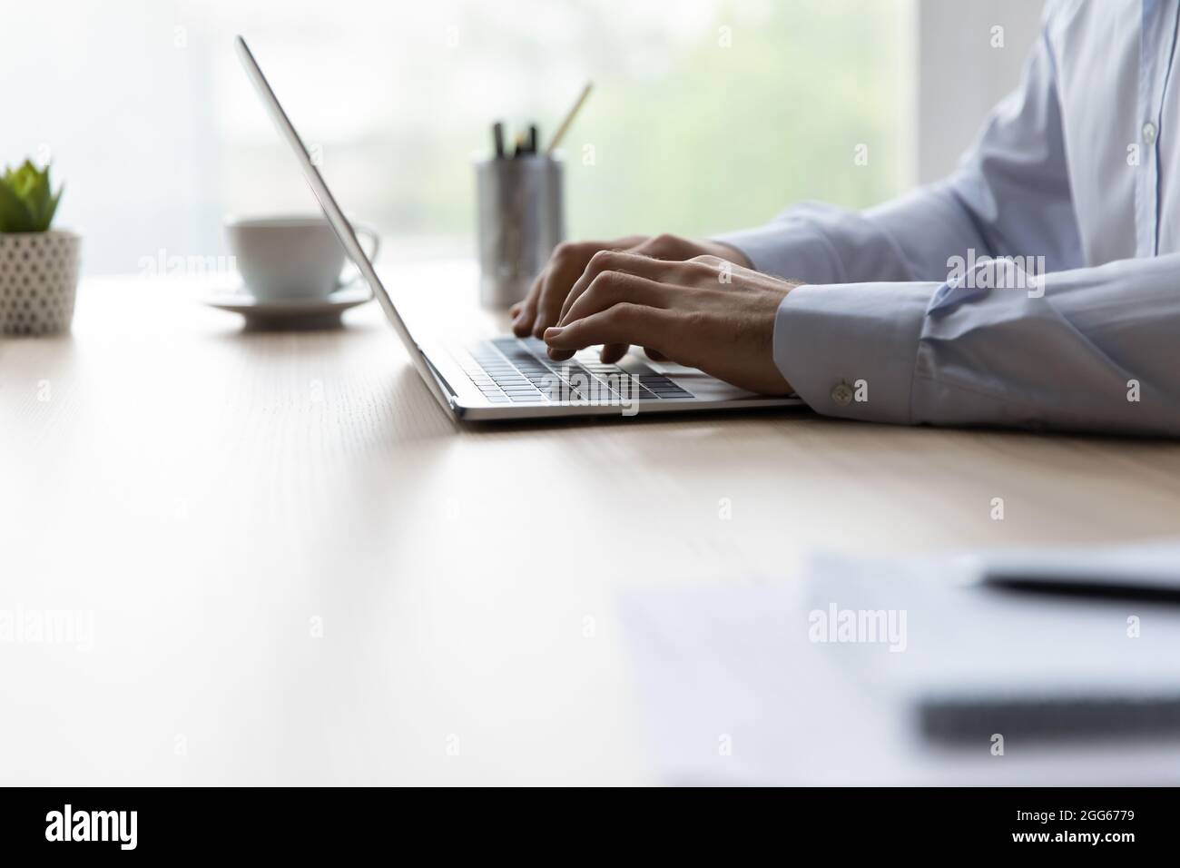 Hands of office employee typing on laptop keyboard at workplace Stock ...