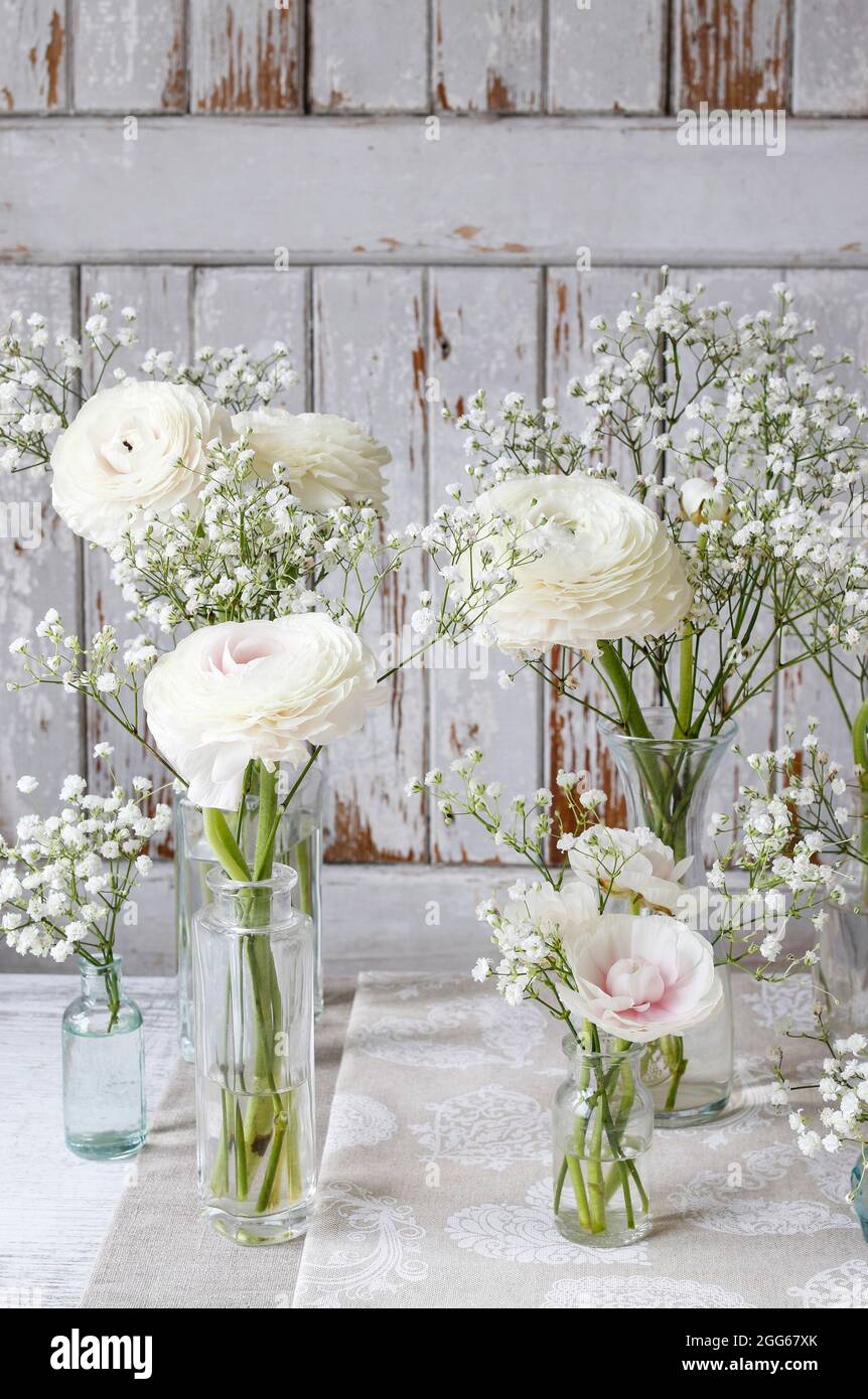 Floral arrangement with ranunculus flowers and white gypsophila ...