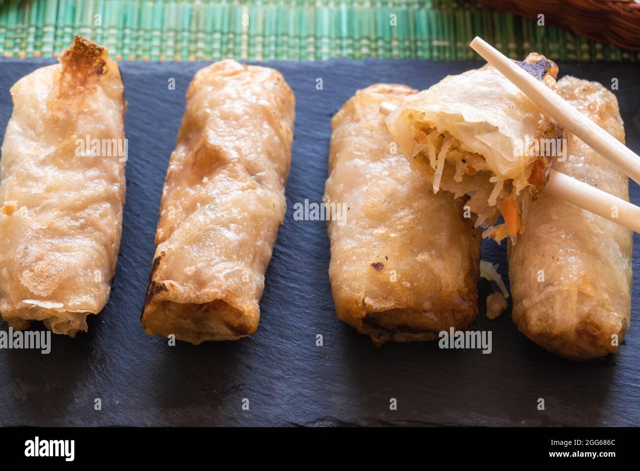 The Vietnamese Nem Ran fried delicious vegetable spring rolls on a blue ...