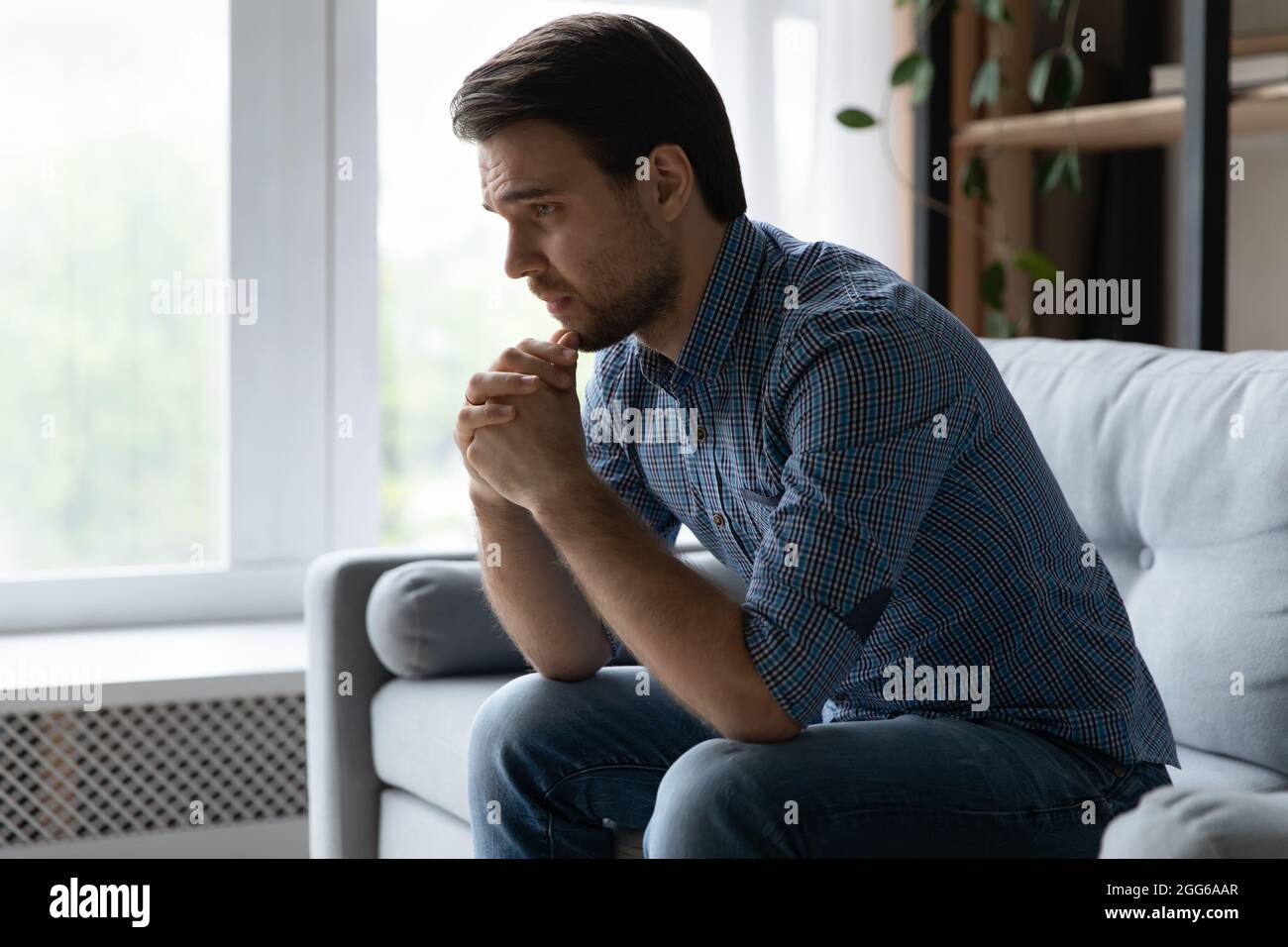Frustrated desperate young man coping with loss, grief Stock Photo - Alamy