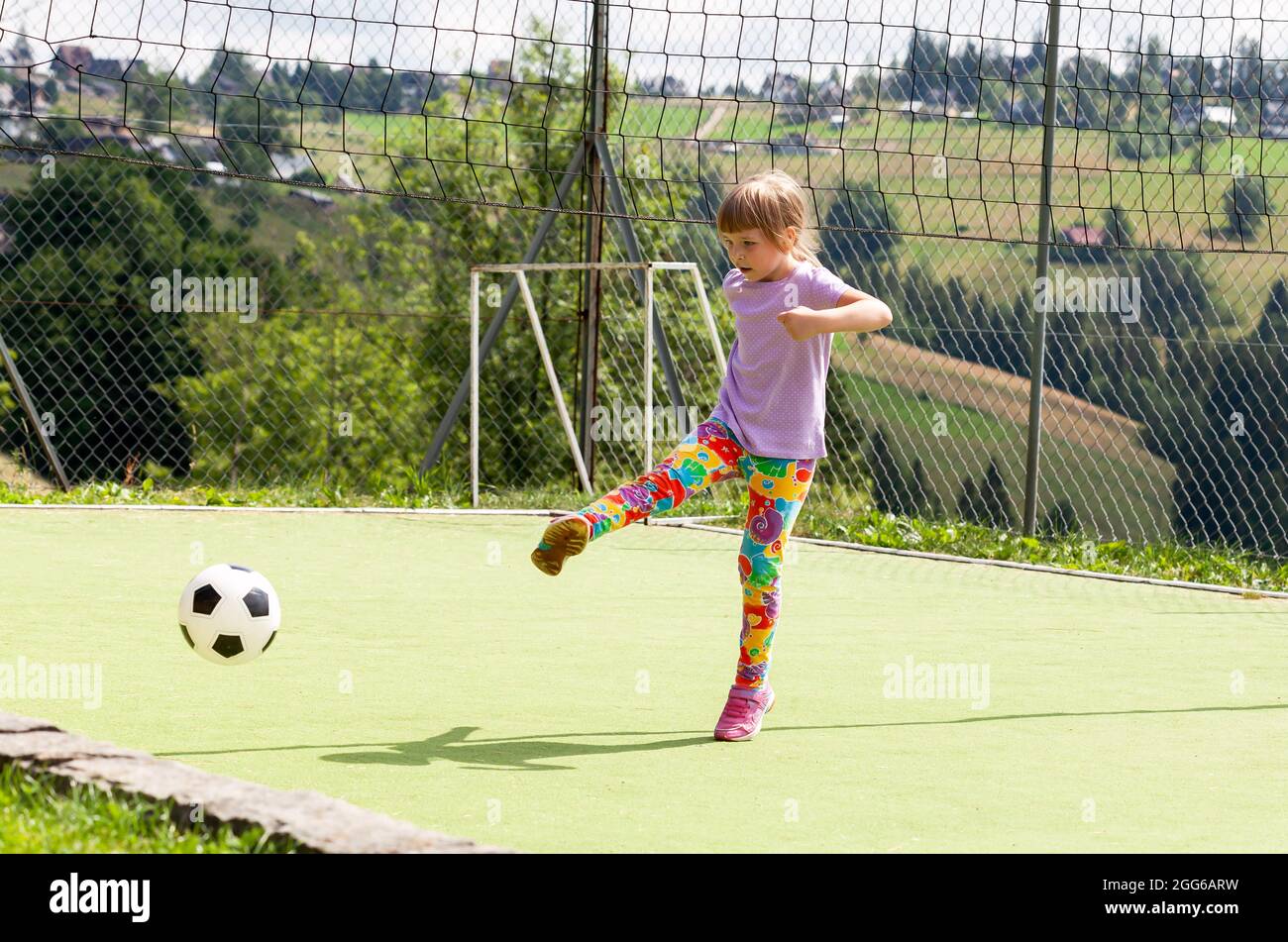 One little active child, healthy young school age girl playing with a ...