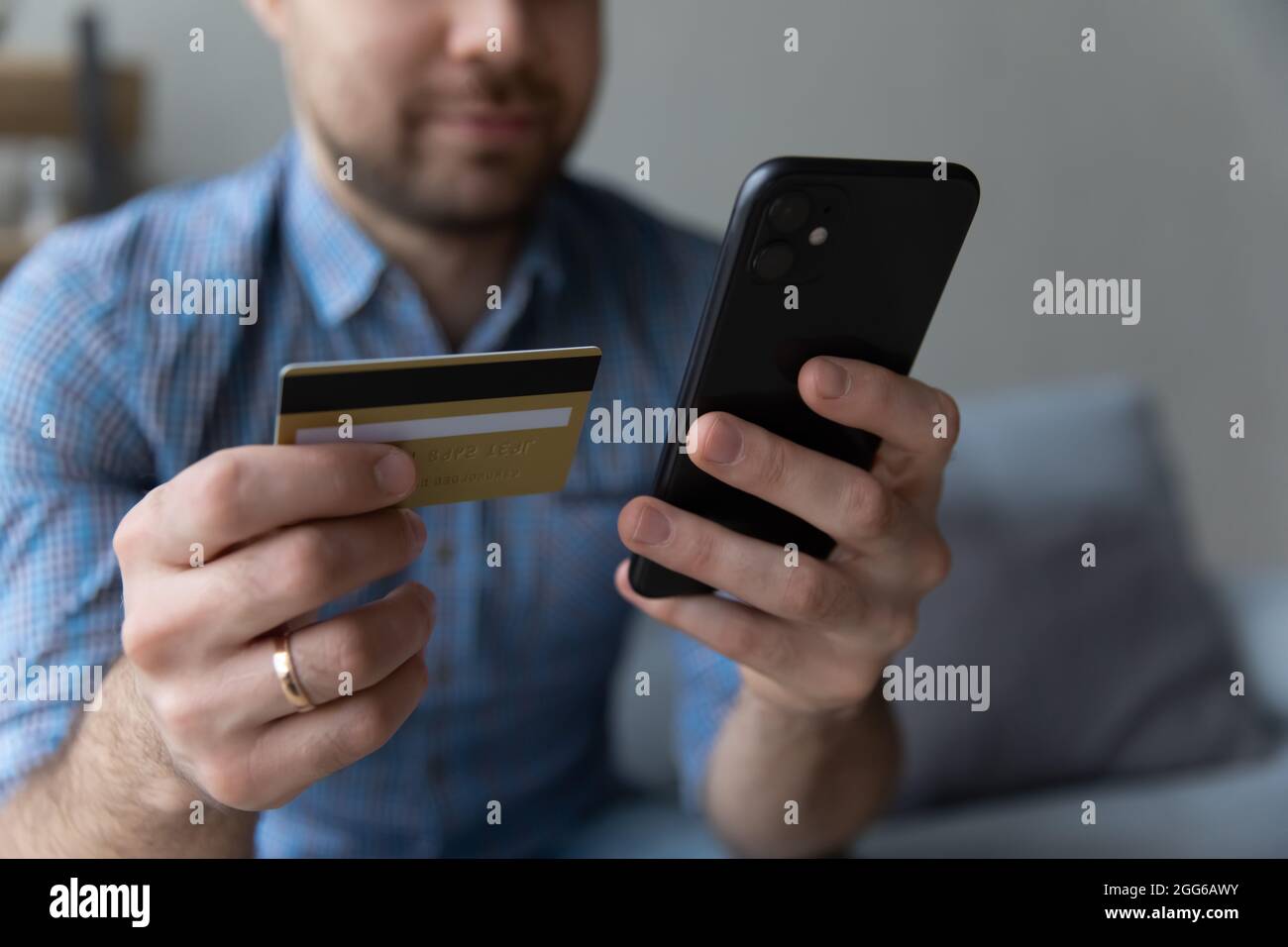 Man holding mobile phone and credit card, using ecommerce app Stock ...