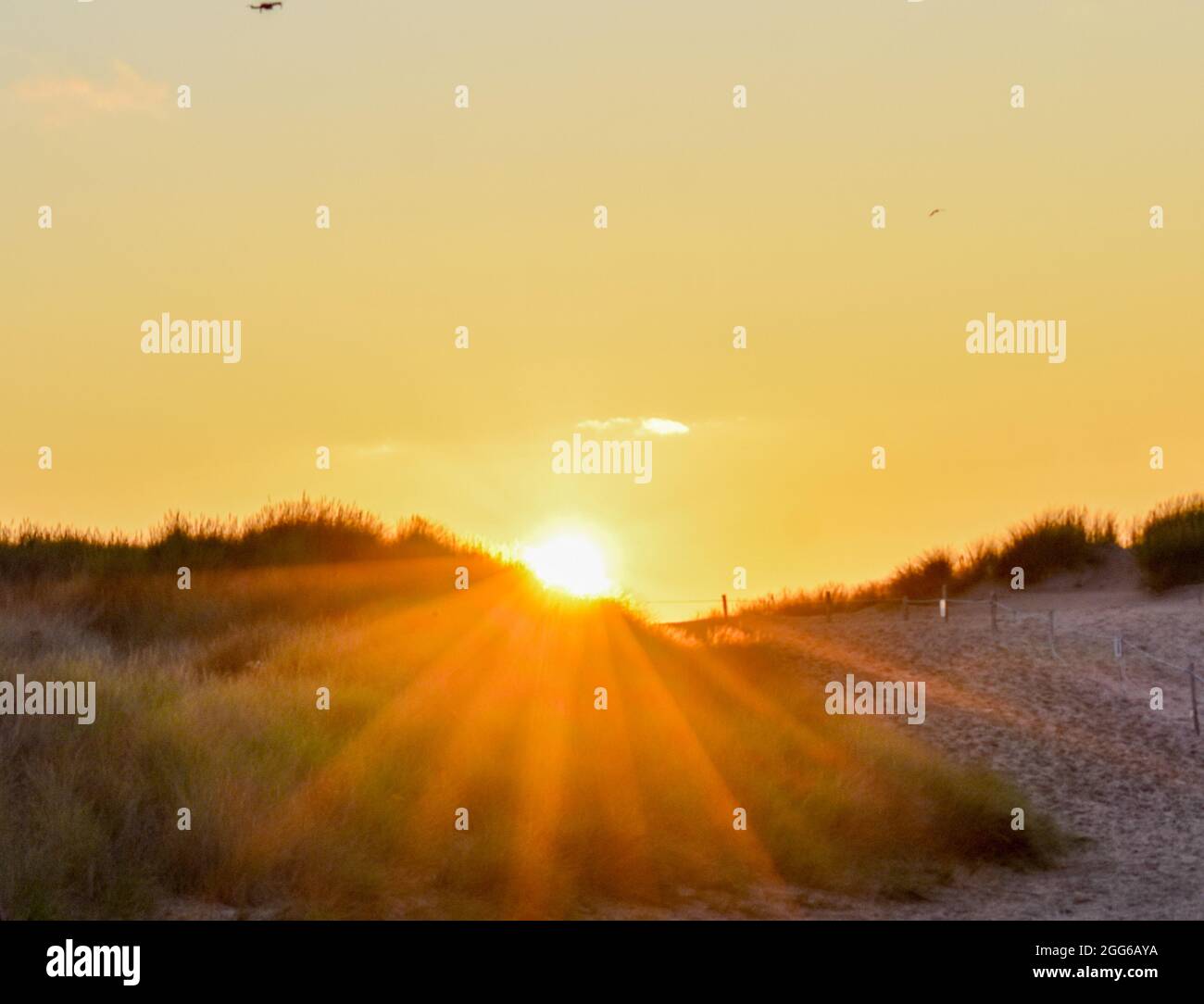The fantastic sunset over the Welsh coastal resorts of West Wales Stock ...