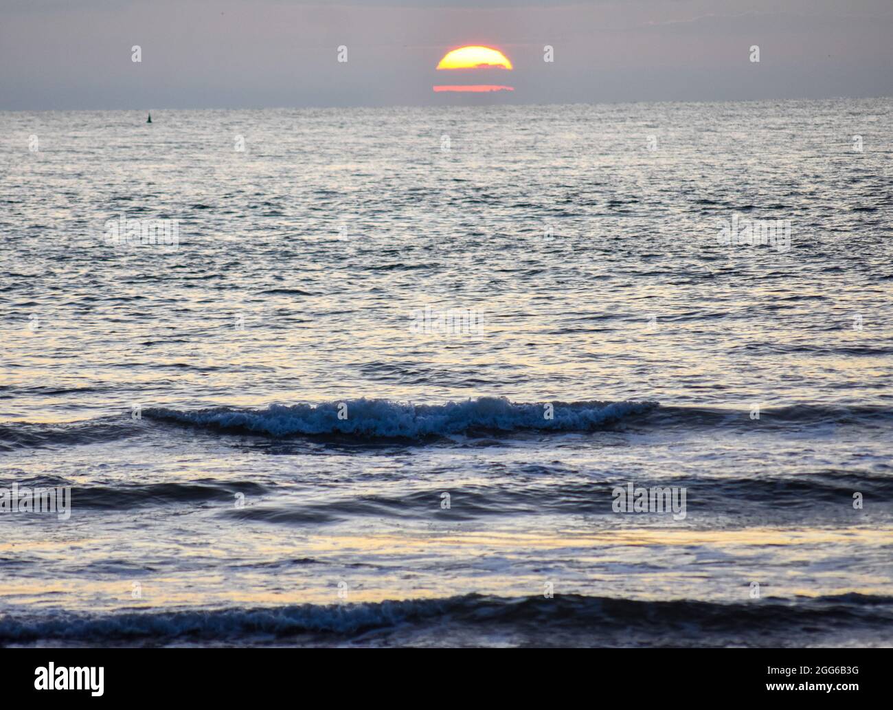 The fantastic sunset over the Welsh coastal resorts of West Wales Stock ...