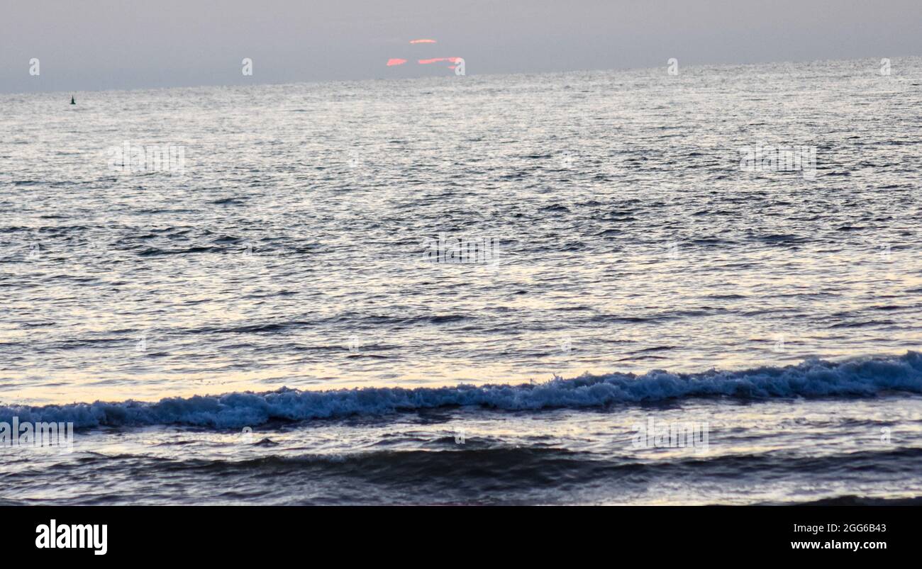 The fantastic sunset over the Welsh coastal resorts of West Wales Stock ...