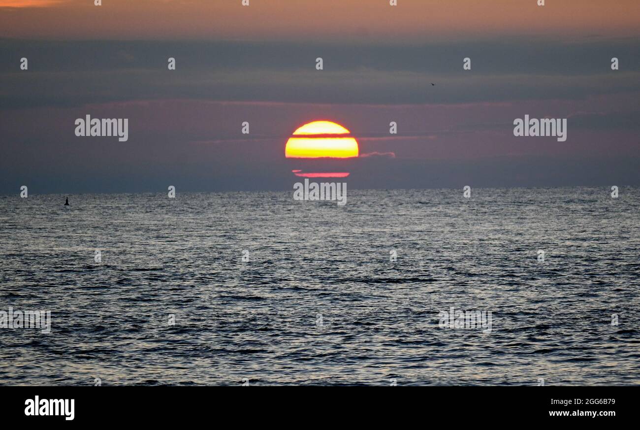 The fantastic sunset over the Welsh coastal resorts of West Wales Stock ...