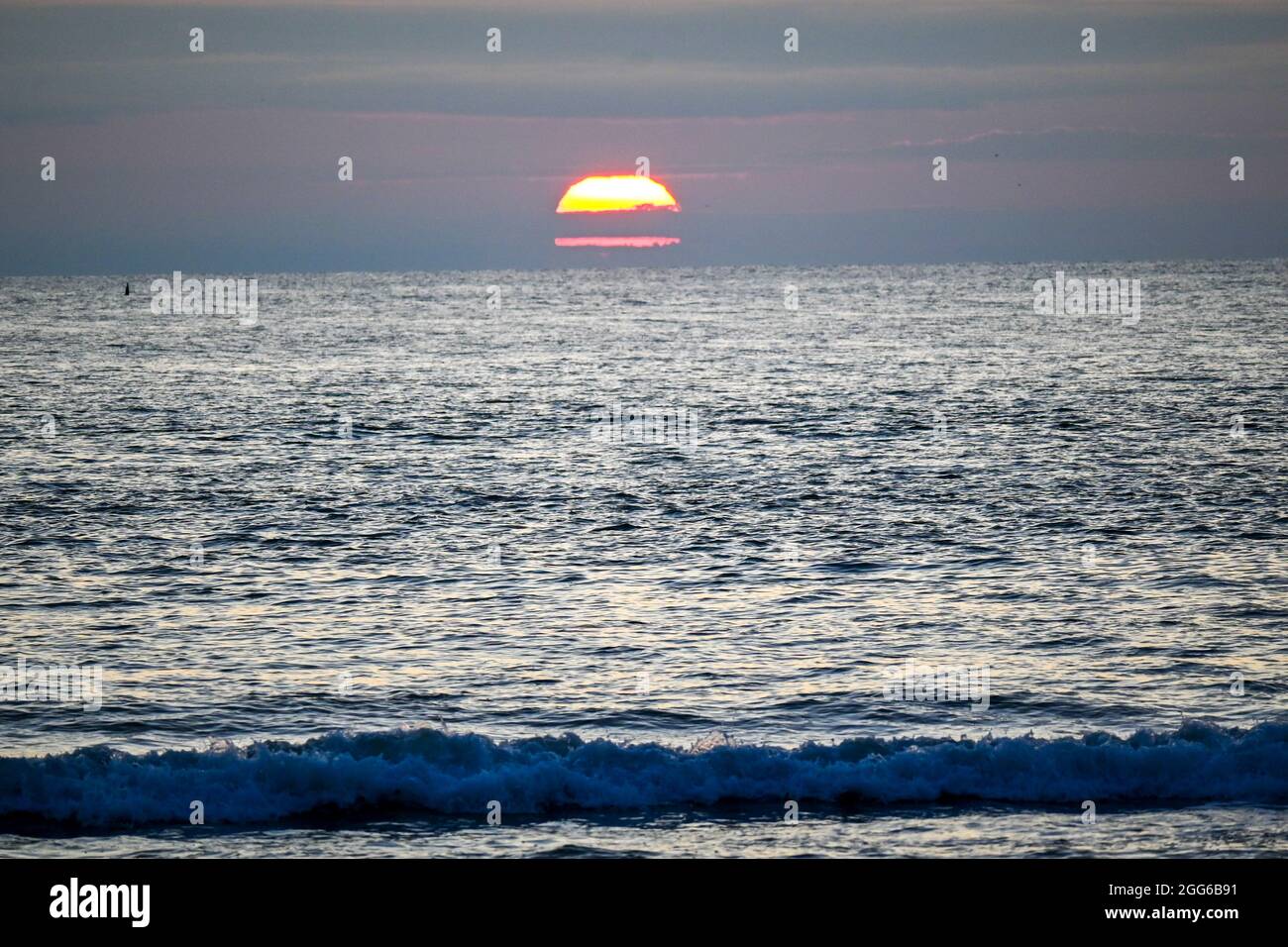 The fantastic sunset over the Welsh coastal resorts of West Wales Stock ...