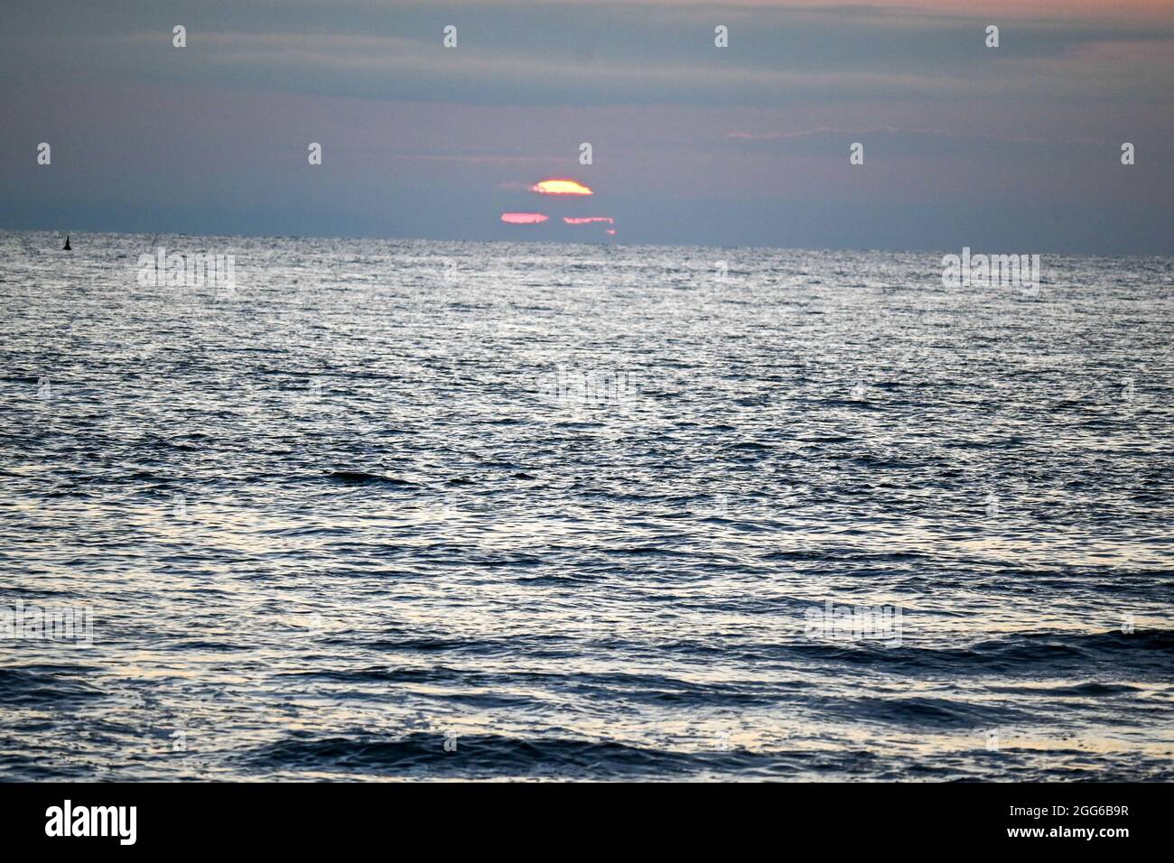 The fantastic sunset over the Welsh coastal resorts of West Wales Stock ...