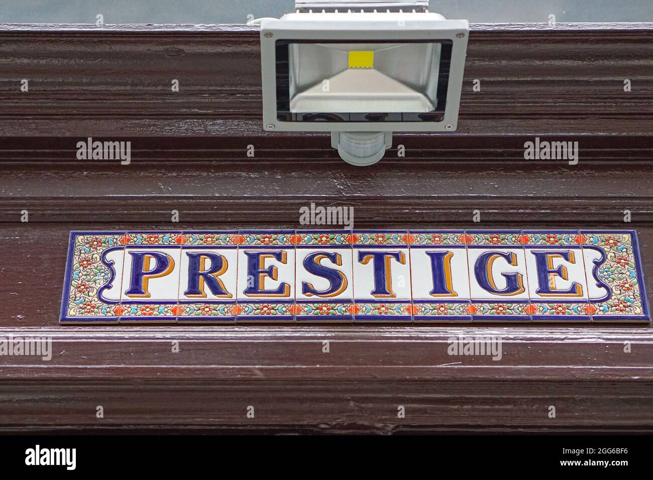 Prestige ceramic tiles sign with reflector at building exterior Stock ...