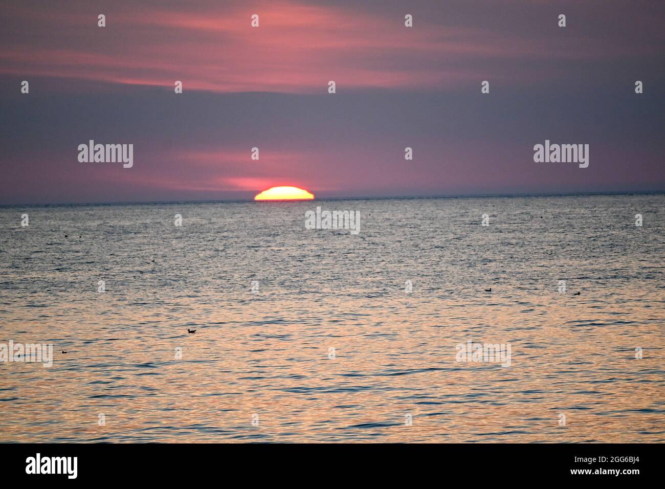 The fantastic sunset over the Welsh coastal resorts of West Wales Stock ...