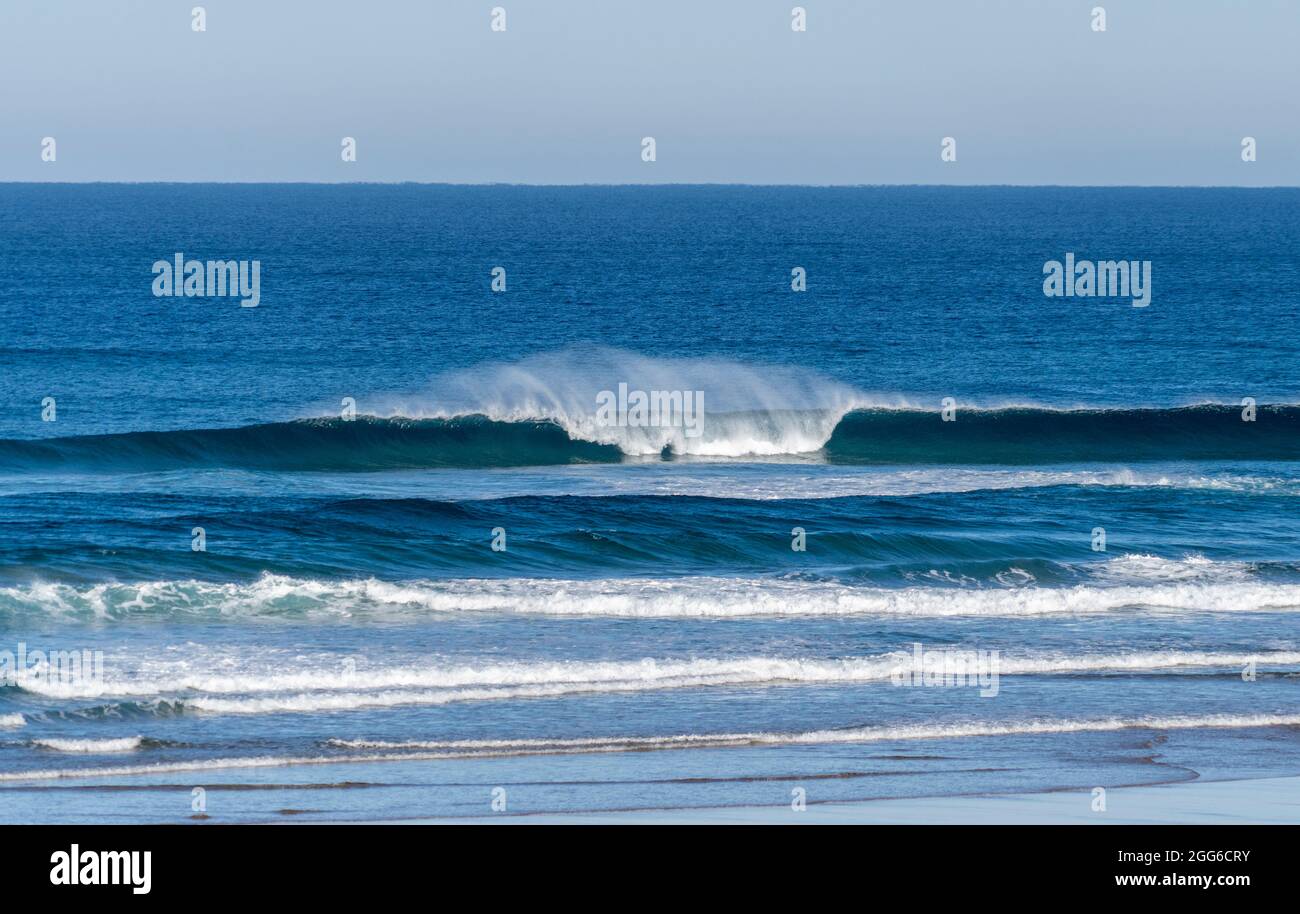 Wave breaking on a bright sunny morning. Perfect wave barrel with ...