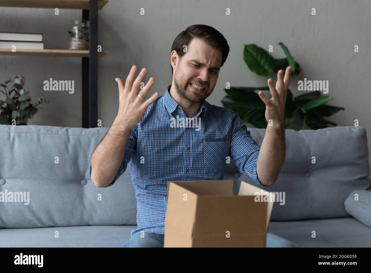 Angry dissatisfied customer receiving wrong parcel from internet store ...