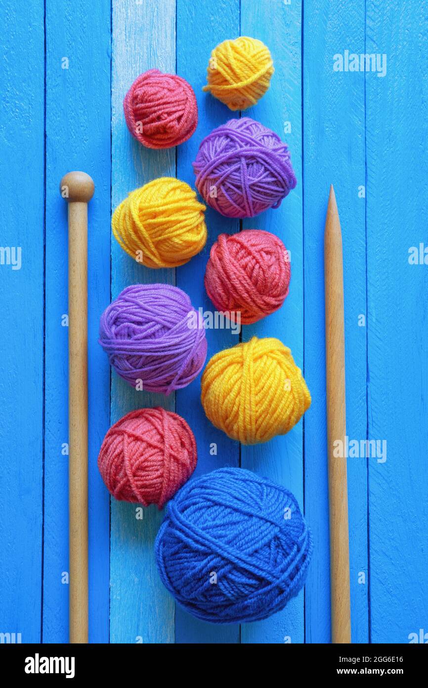 Hobbies and knitting concept. Colorful balls of wool and knitting ...