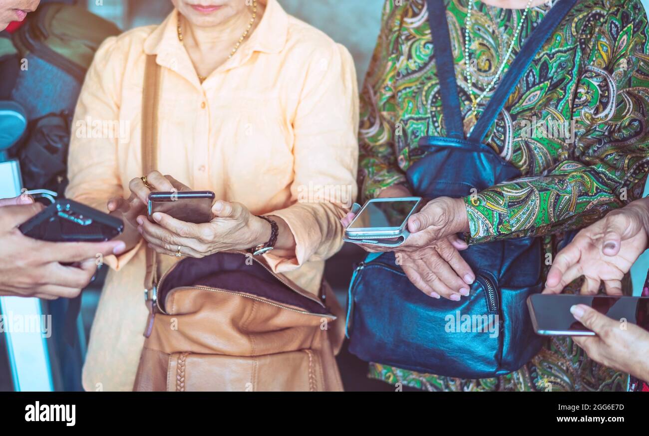 Elderly women learn how to use applications related to language ...