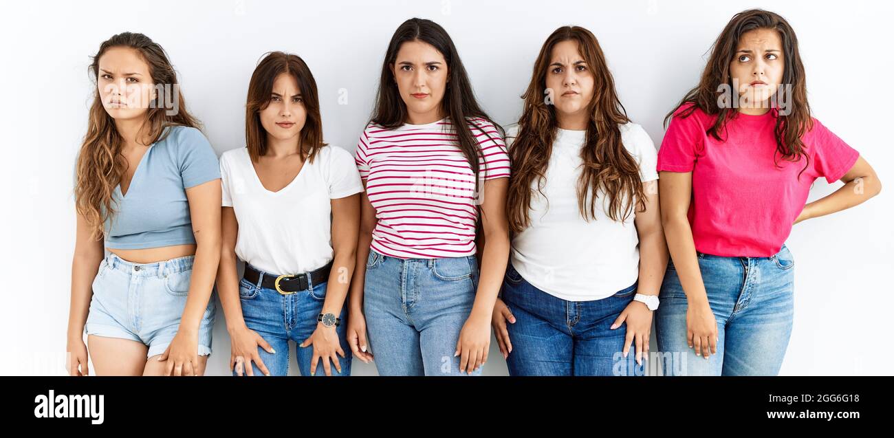 Group of women wearing casual clothes standing over isolated background ...