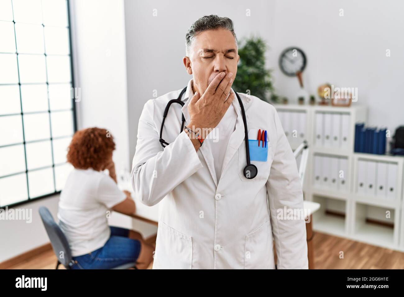 Patient yawning at doctor hi-res stock photography and images - Alamy