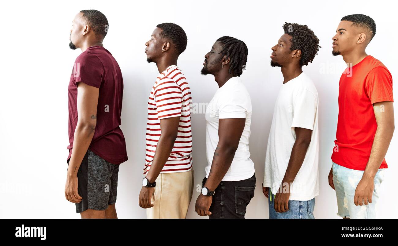 Young african group of friends standing together over isolated ...