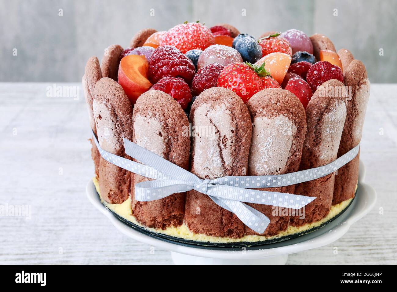 French charlotte cake with summer fruits. Party dessert Stock Photo - Alamy
