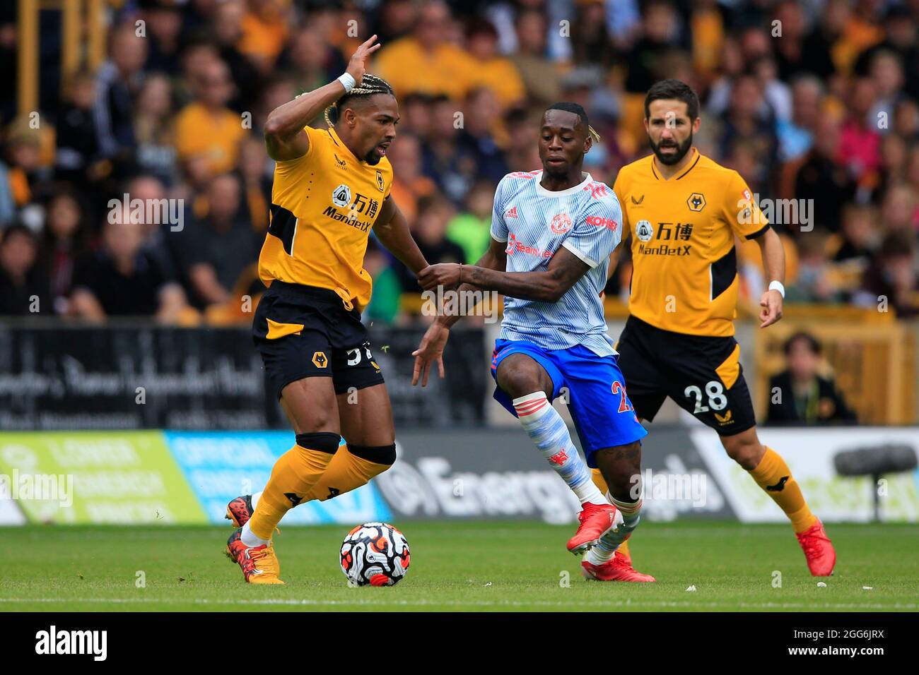 Adama Traore #37 of Wolverhampton Wanderers and Aaron Wan Bissaka #29 ...